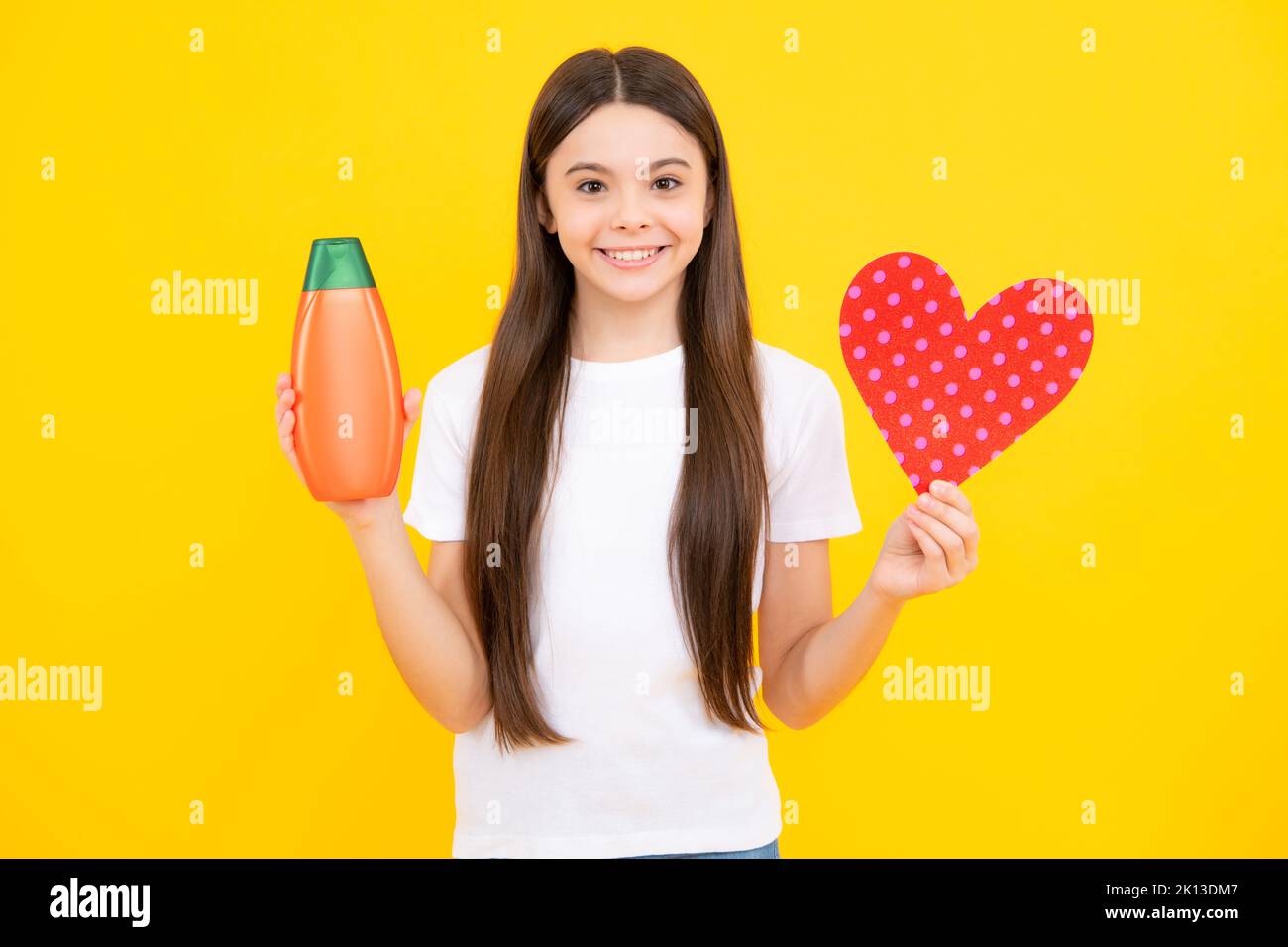 Teenage girl with shampoos conditioners or shower gel. Kids hair care ...
