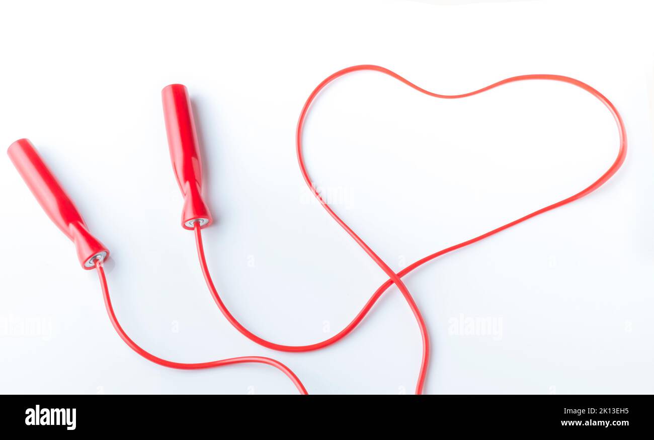 A heart-shaped red jump rope isolated on a white background Stock Photo ...