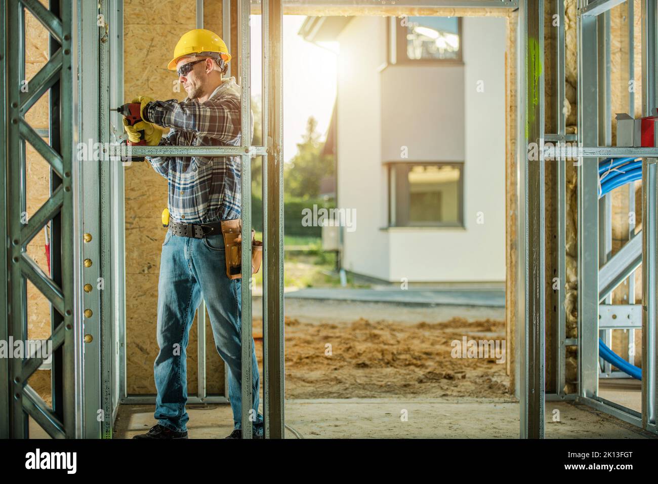 Caucasian Contractor Working on House Steel Skeleton Installation ...