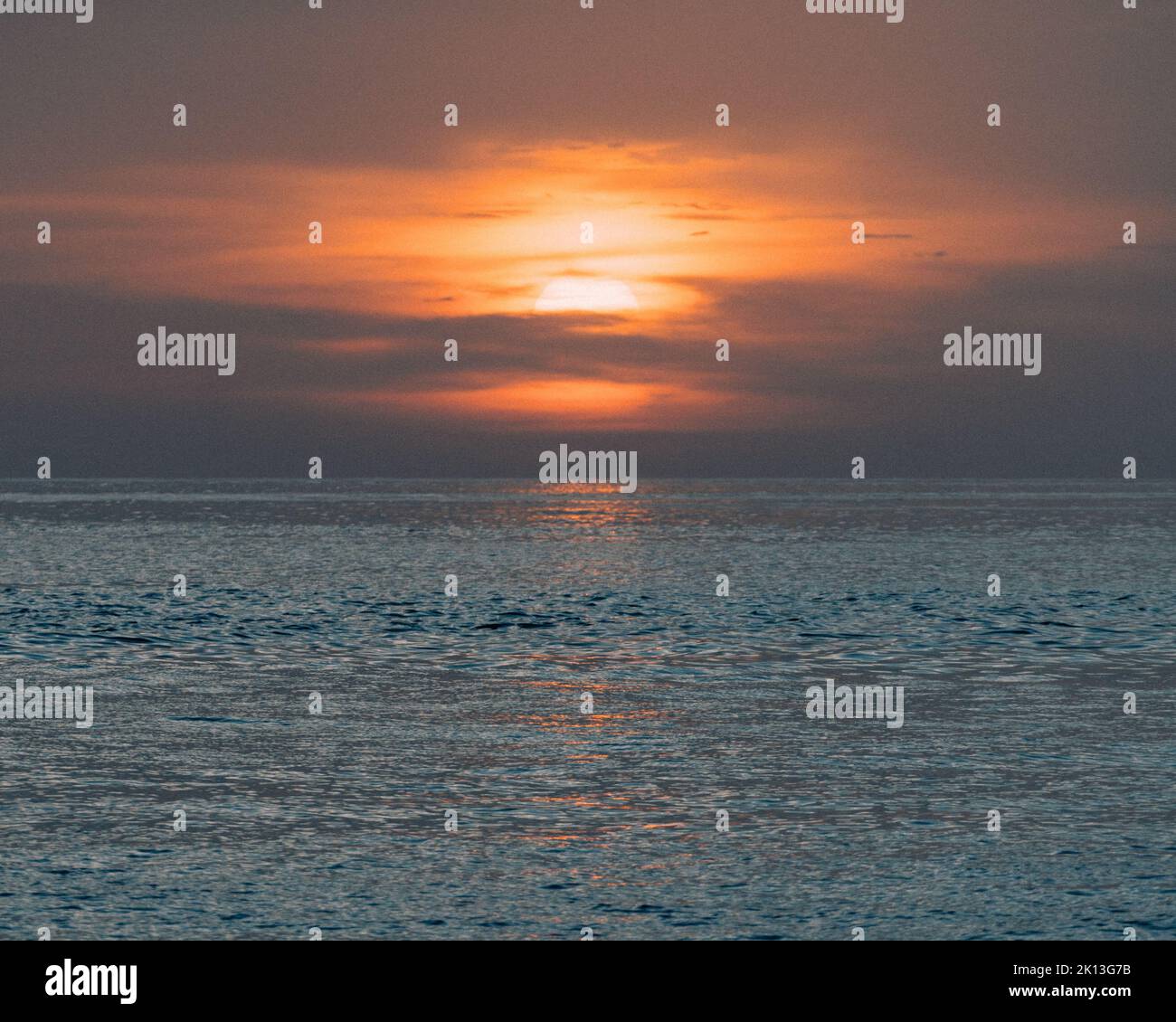 A bright orange sunset sky over the Atlantic Ocean in the Bahamas Stock ...