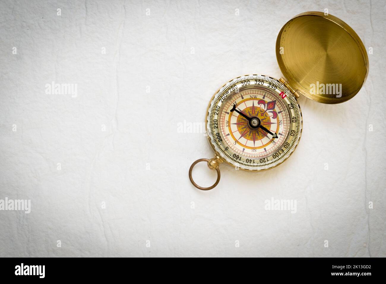 A top closeup of a vintage compass on the white background Stock Photo ...