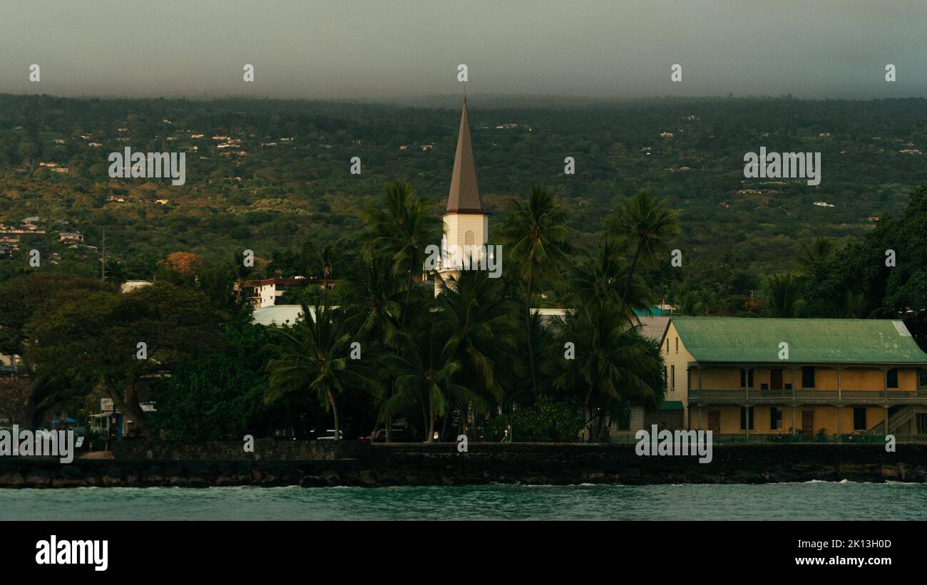 An aerial view of church surrounded growing trees and water in Stock ...