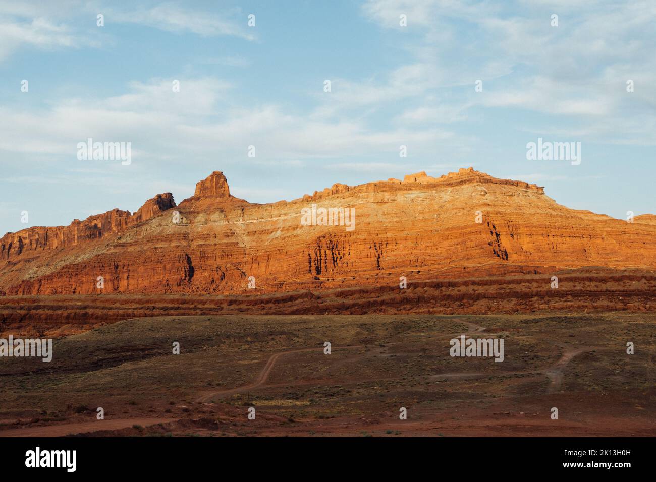 An aerial view of rock formations under blue bright sky in Moab Stock ...