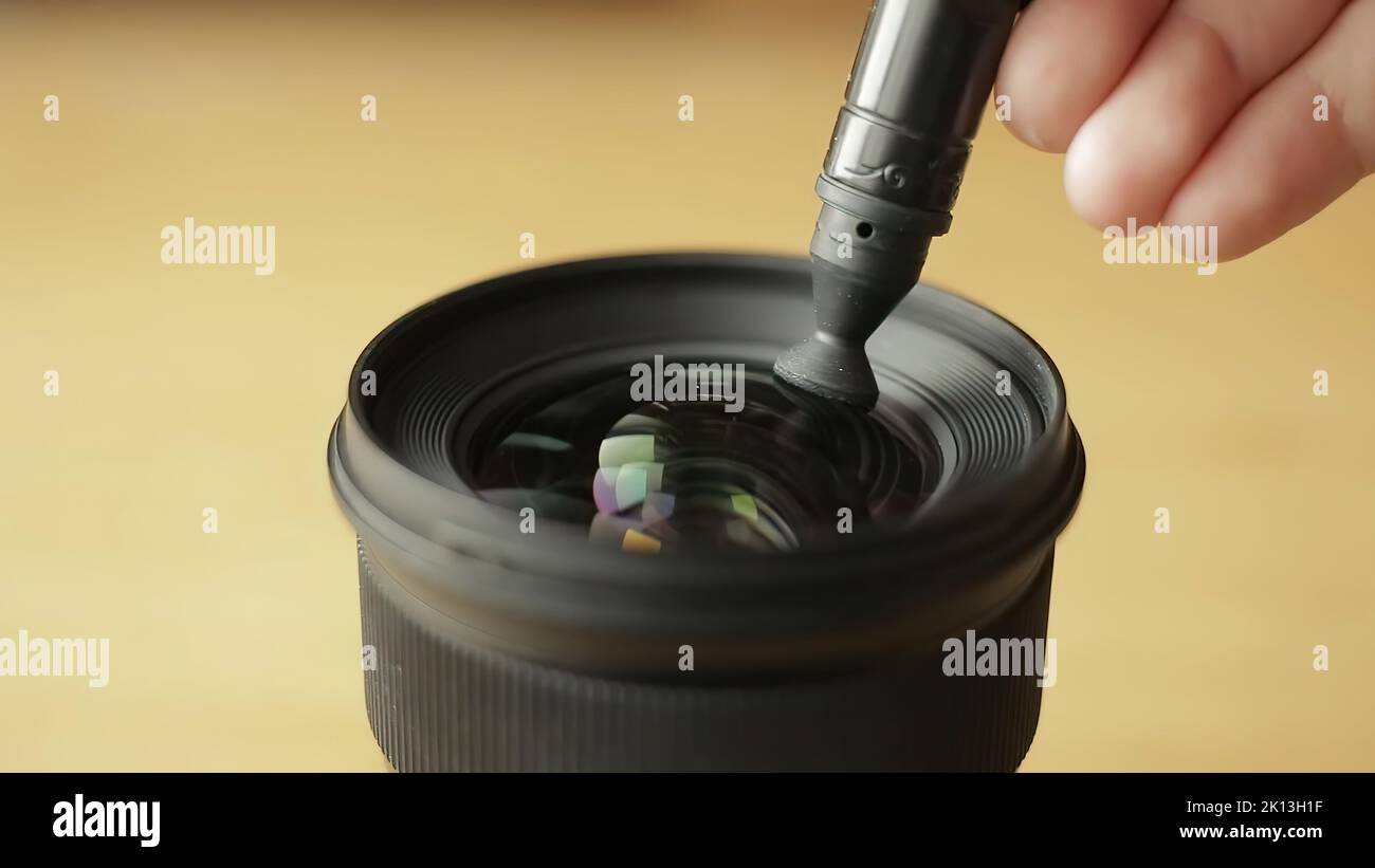 Man cleaning lens digital hi-res stock photography and images - Alamy