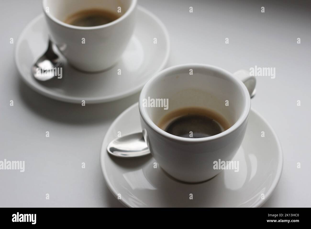 Two Cups of Hot Fresh Espresso Shots on White Table Background. Brewing ...