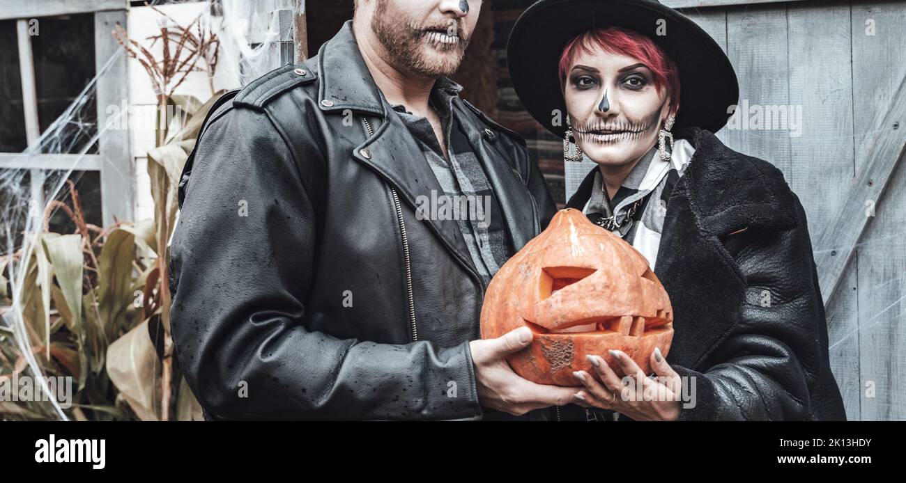 Scary love family couple man,woman celebrating halloween with pumpkin ...