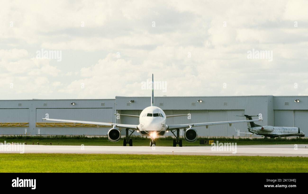 A straight shot of a commercial plane on runway at Fort Lauderdale ...