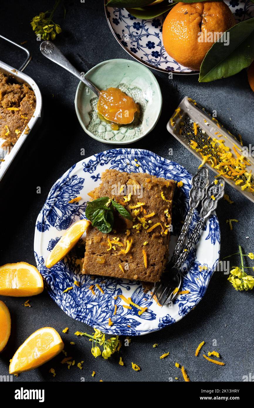 A piece of banana bread with orange zest on beautifully decorated table ...
