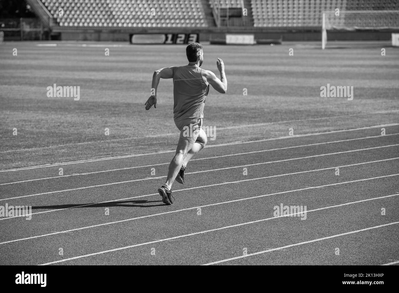 aim and success. man running on stadium. sports and healthy lifestyle ...