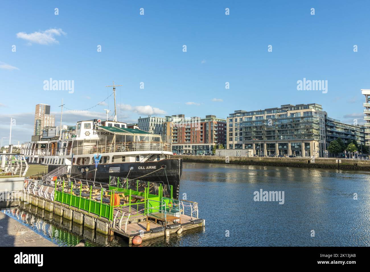The MV Cill Airne boat on the River Liffey, with modern apartments and ...