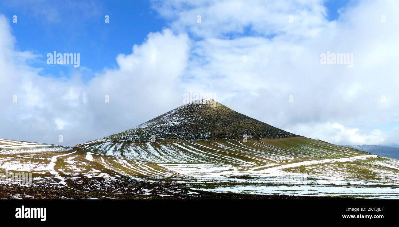 A beautiful perfect cone-shaped mountain during winter in the ...