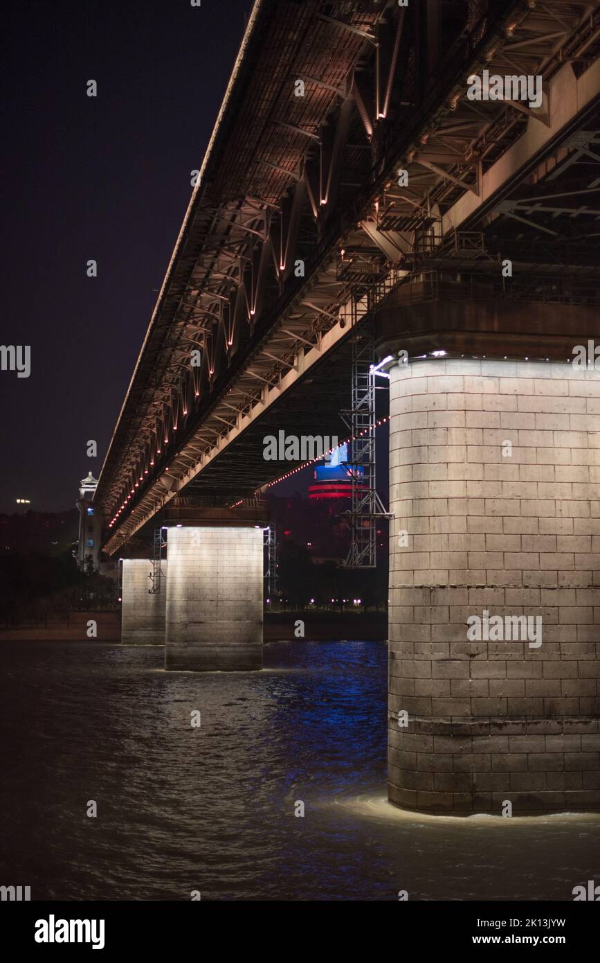 A vertical shot of under the Wuhan Changjiang River Bridge at night ...
