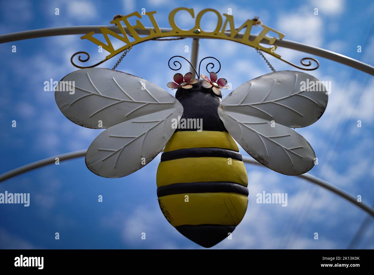 A welcome sign with a bee symbol Stock Photo - Alamy