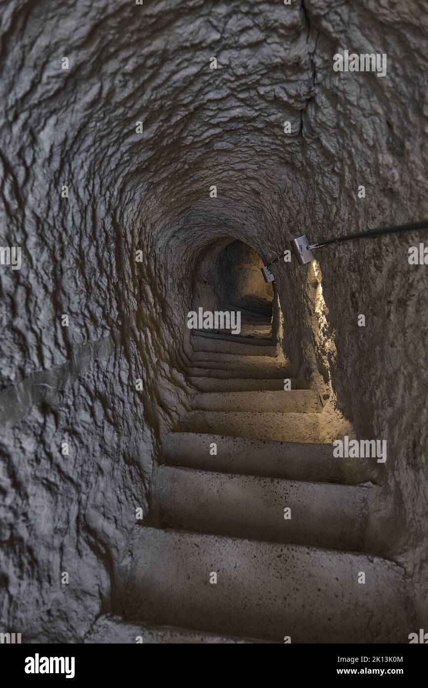 A vertical shot of the inside of a cave with stairs Stock Photo - Alamy