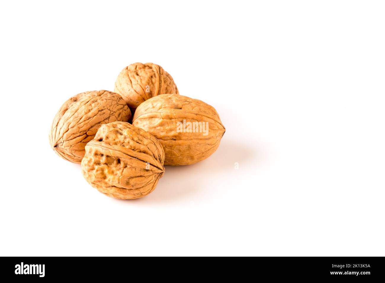 A closeup of walnuts against a white background Stock Photo - Alamy