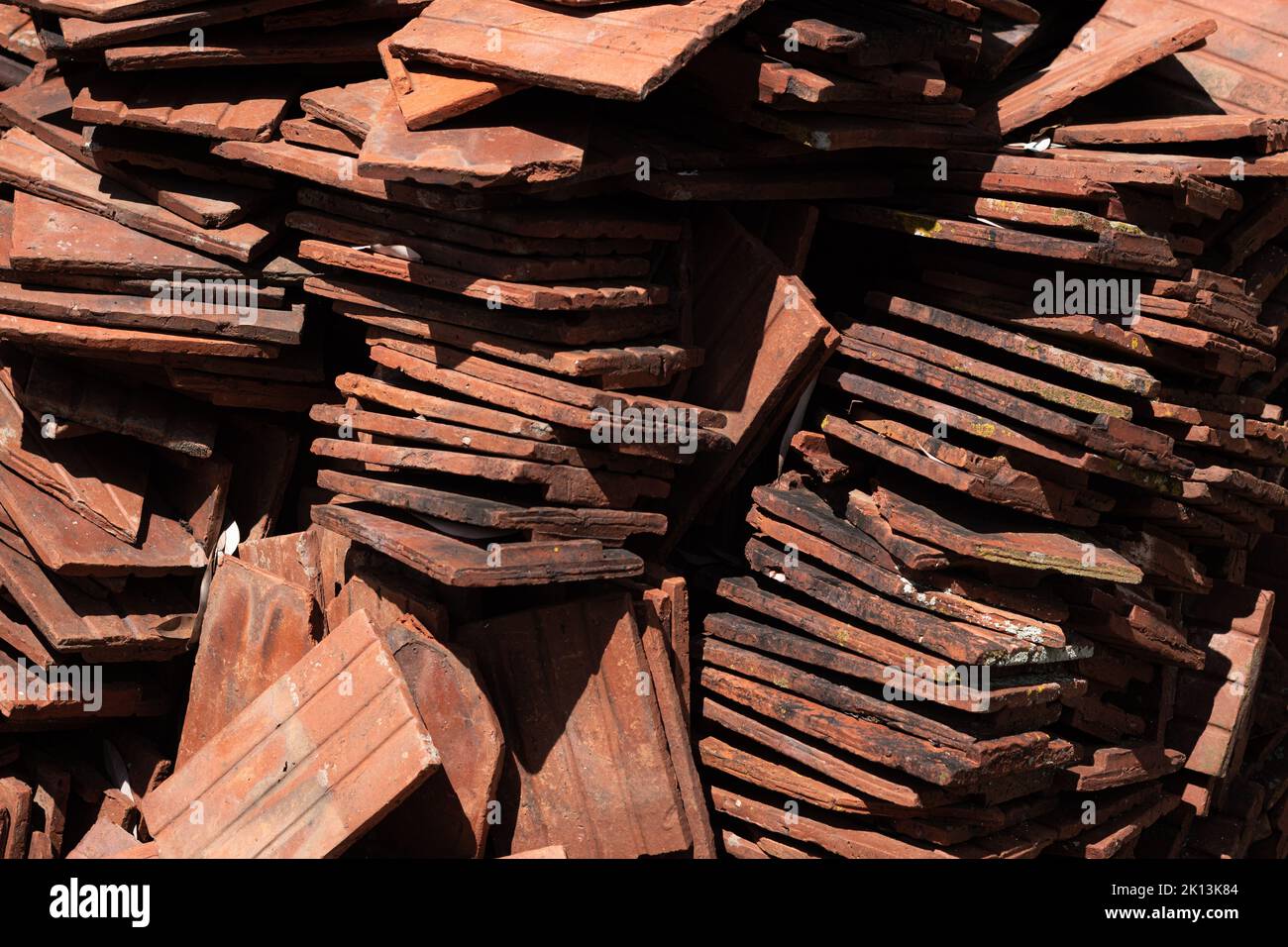 Some clay broken old roof tiles gathered Stock Photo - Alamy