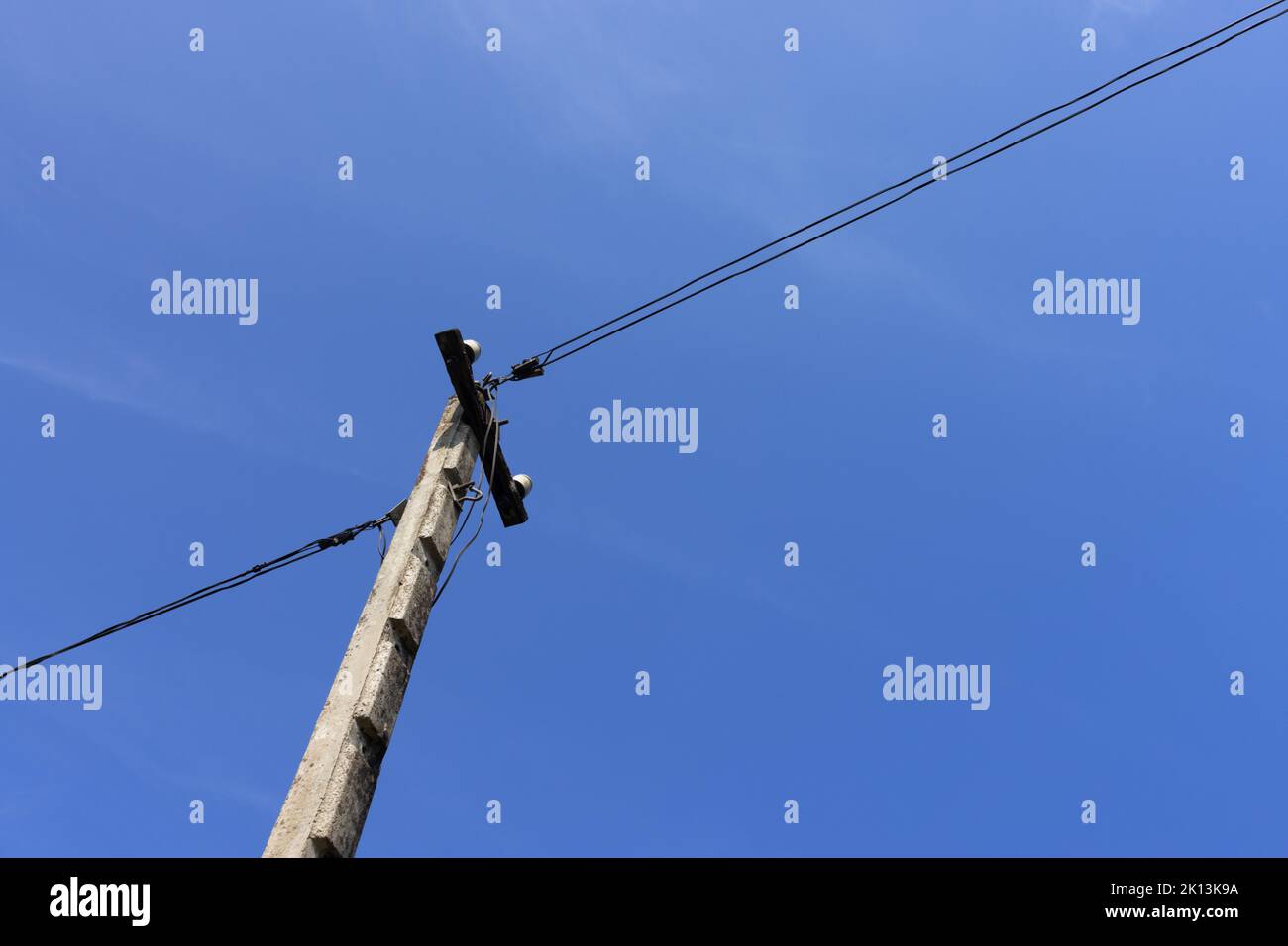 Low angle shot of an Electric pole with wires Stock Photo - Alamy