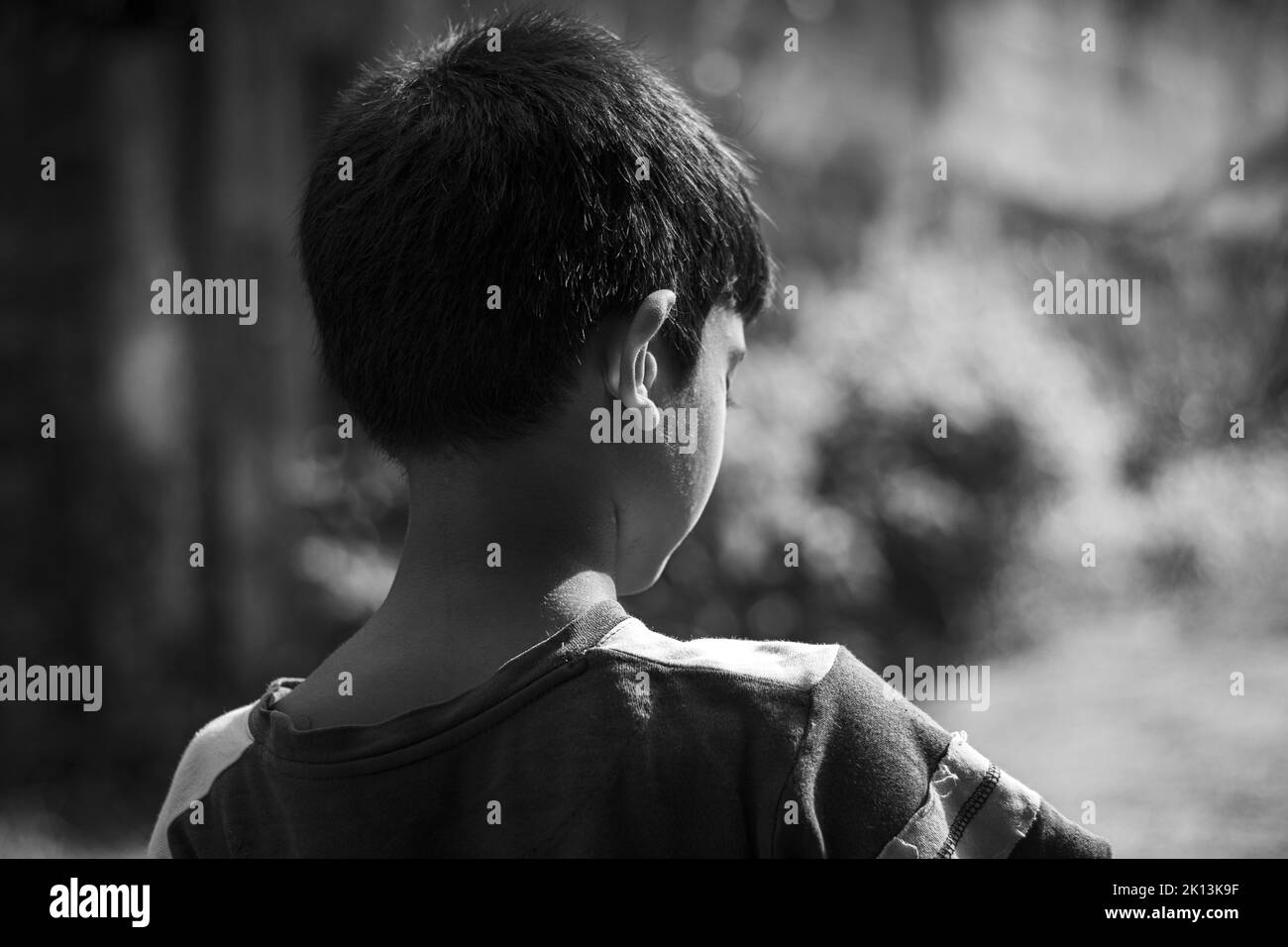 Little young boy facing away from the camera Stock Photo - Alamy