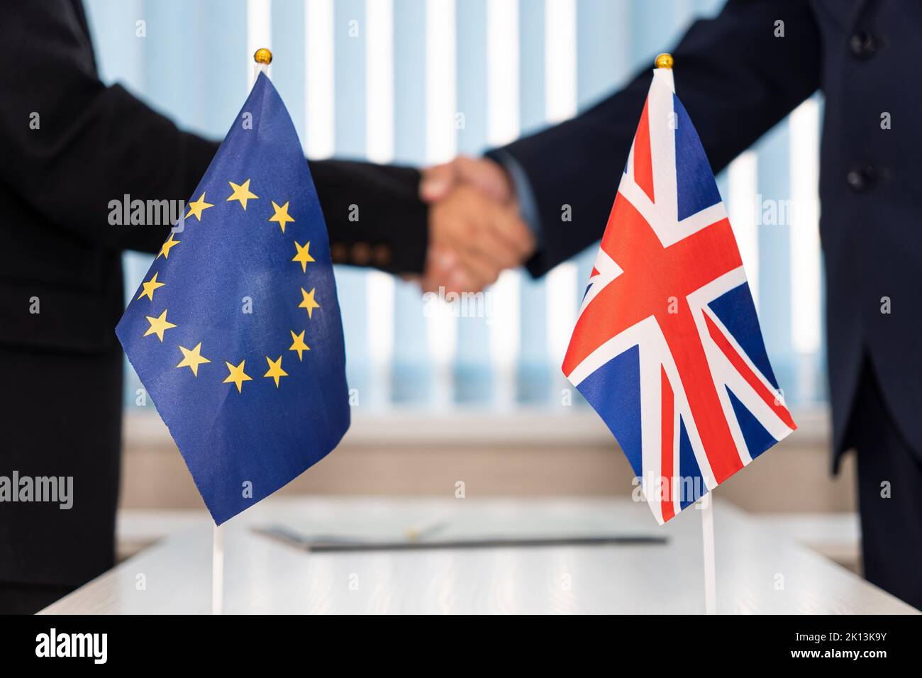 Political flags of European Union and United Kingdom on table. concept ...