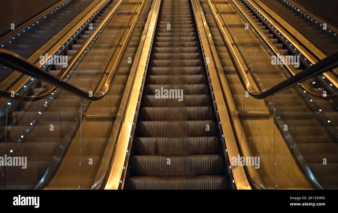 Electric escalator in metro. Moving staircase Stock Photo - Alamy