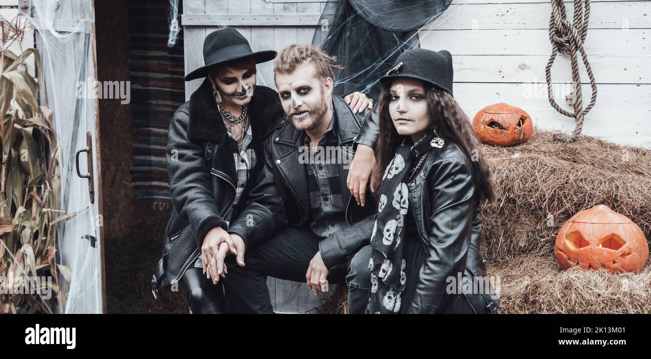Scary family, mother, father, daughters celebrating halloween ...