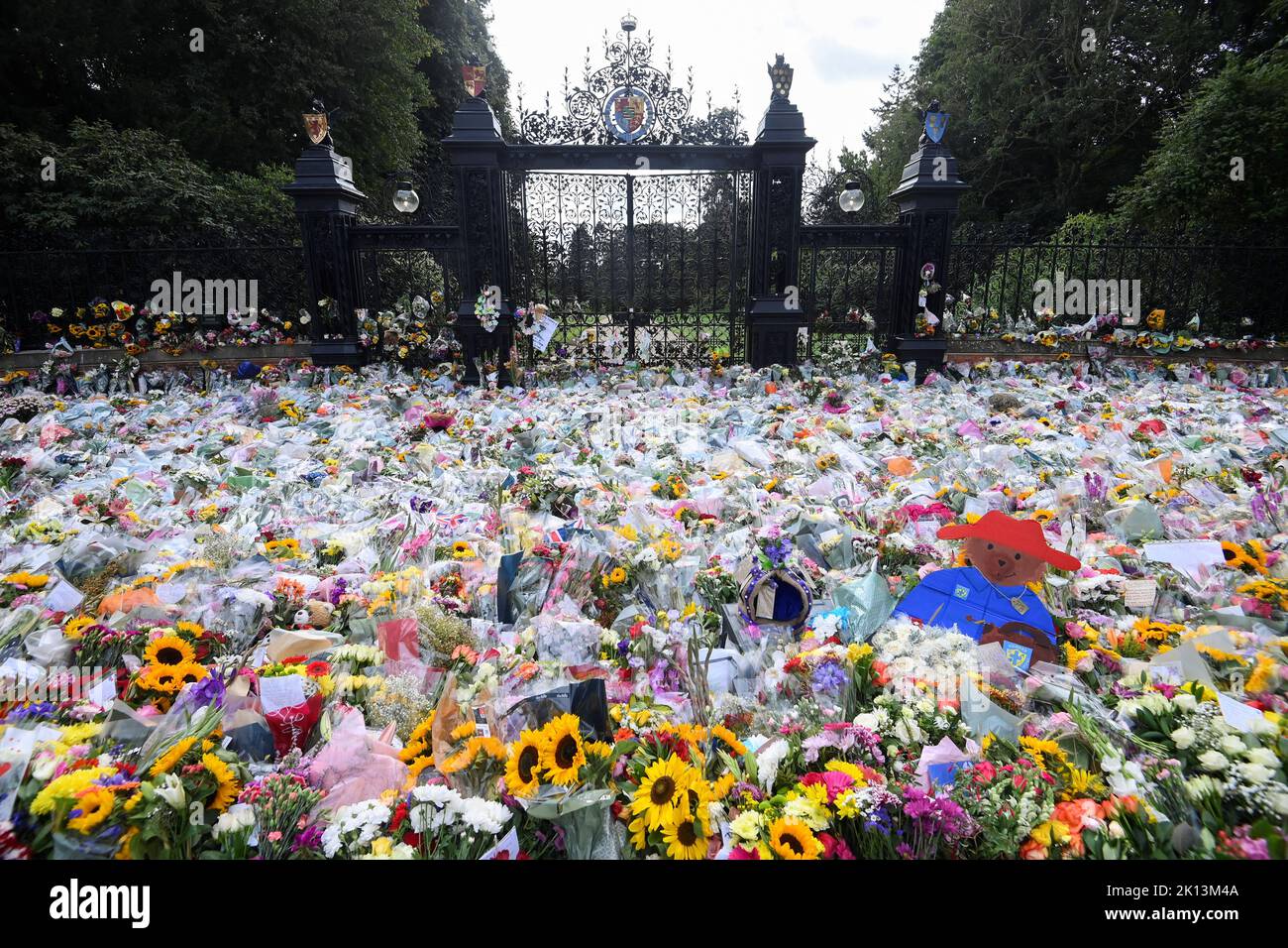 Floral tributes left by members of the public at the gates of ...