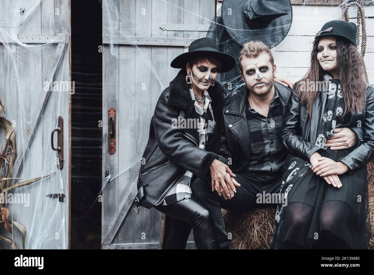 Scary family, mother, father, daughters celebrating halloween ...