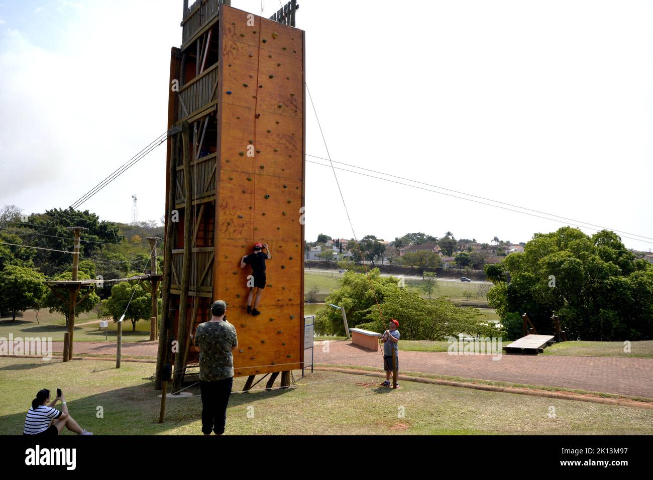 Climbing. Wooden climbing tower with student, instructor and tourists ...