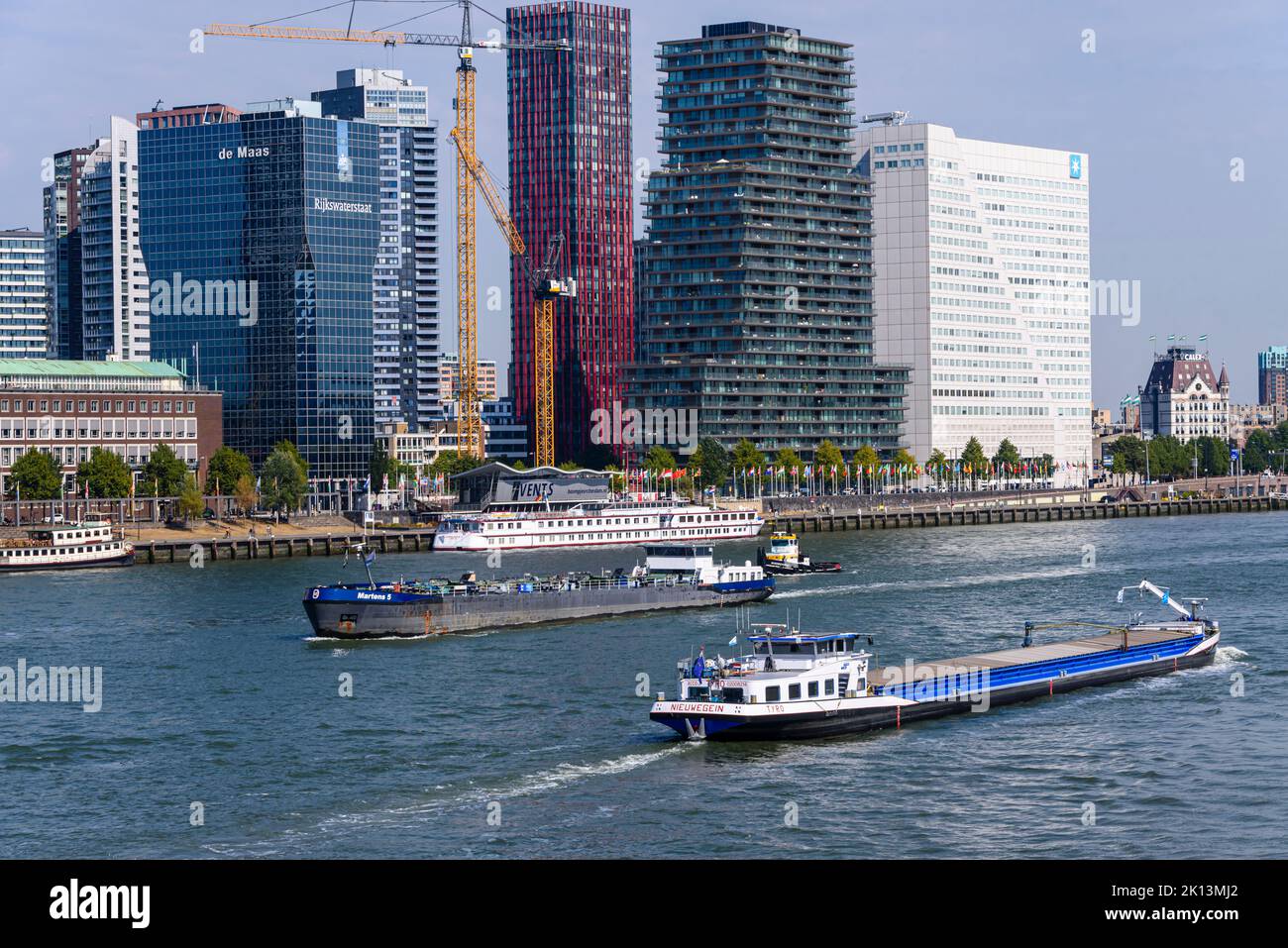 Barges sail past tall office buildings, Rotterdam, Netherlands Stock ...