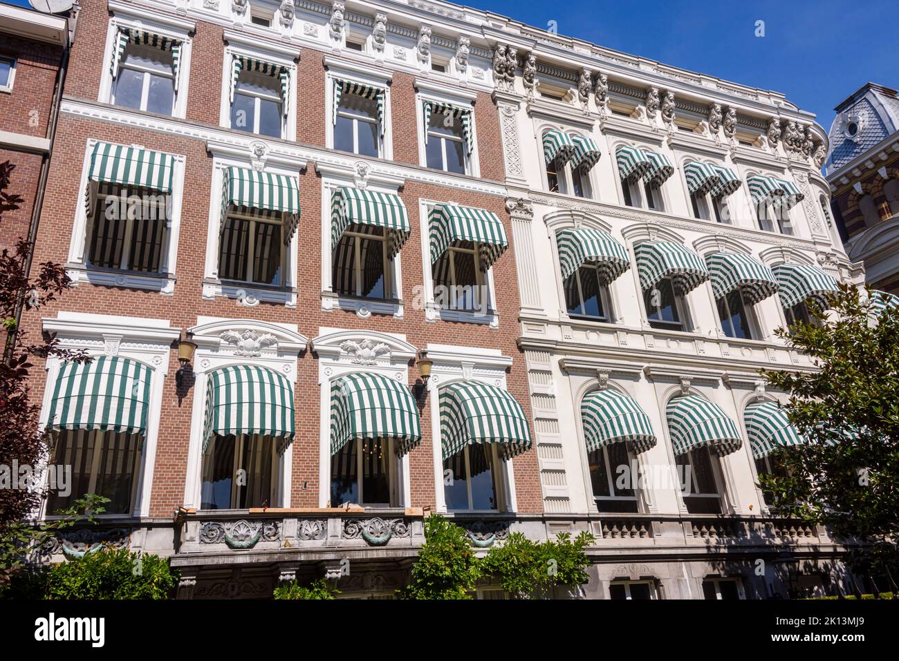 Striped awnings window shades on an old building in Rotterdam ...