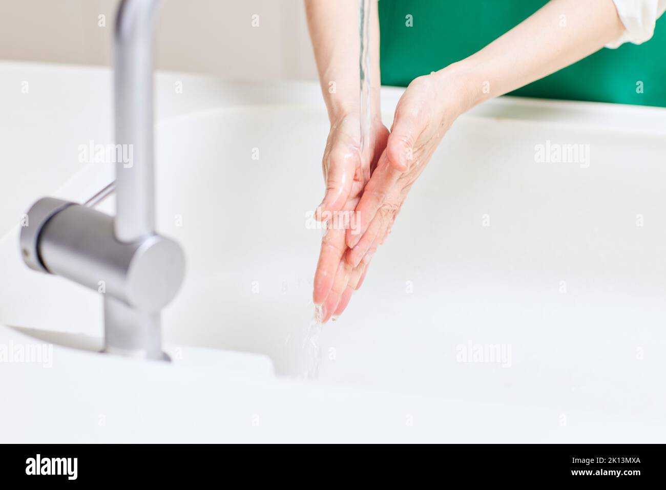Senior woman washing hands hi-res stock photography and images - Alamy