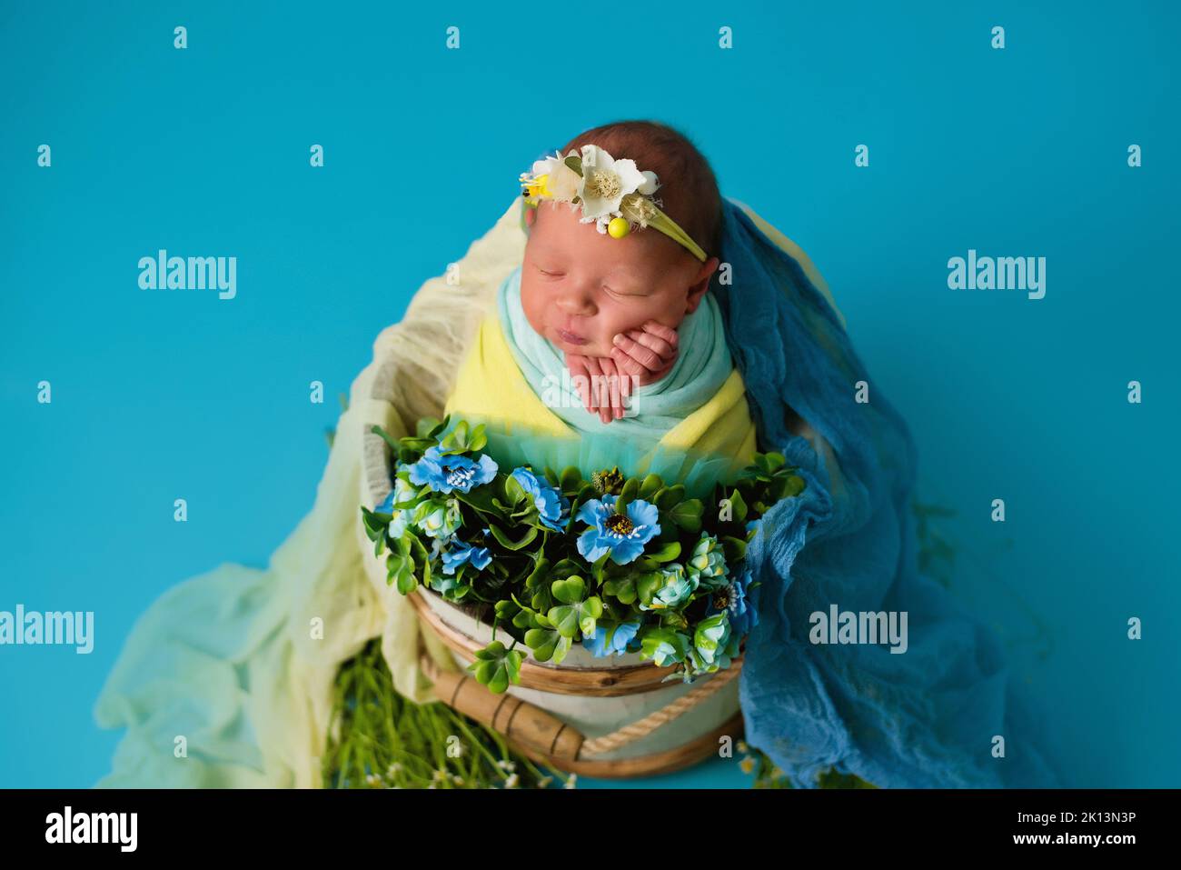 Ukrainian newborn in the studio patriotic blue yellow colors during the ...