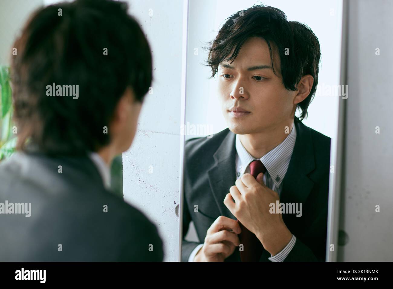 Japanese man getting ready at home Stock Photo - Alamy