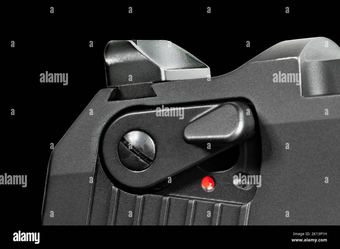 Safety off on a semi-automatic pistol on a black background Stock Photo ...