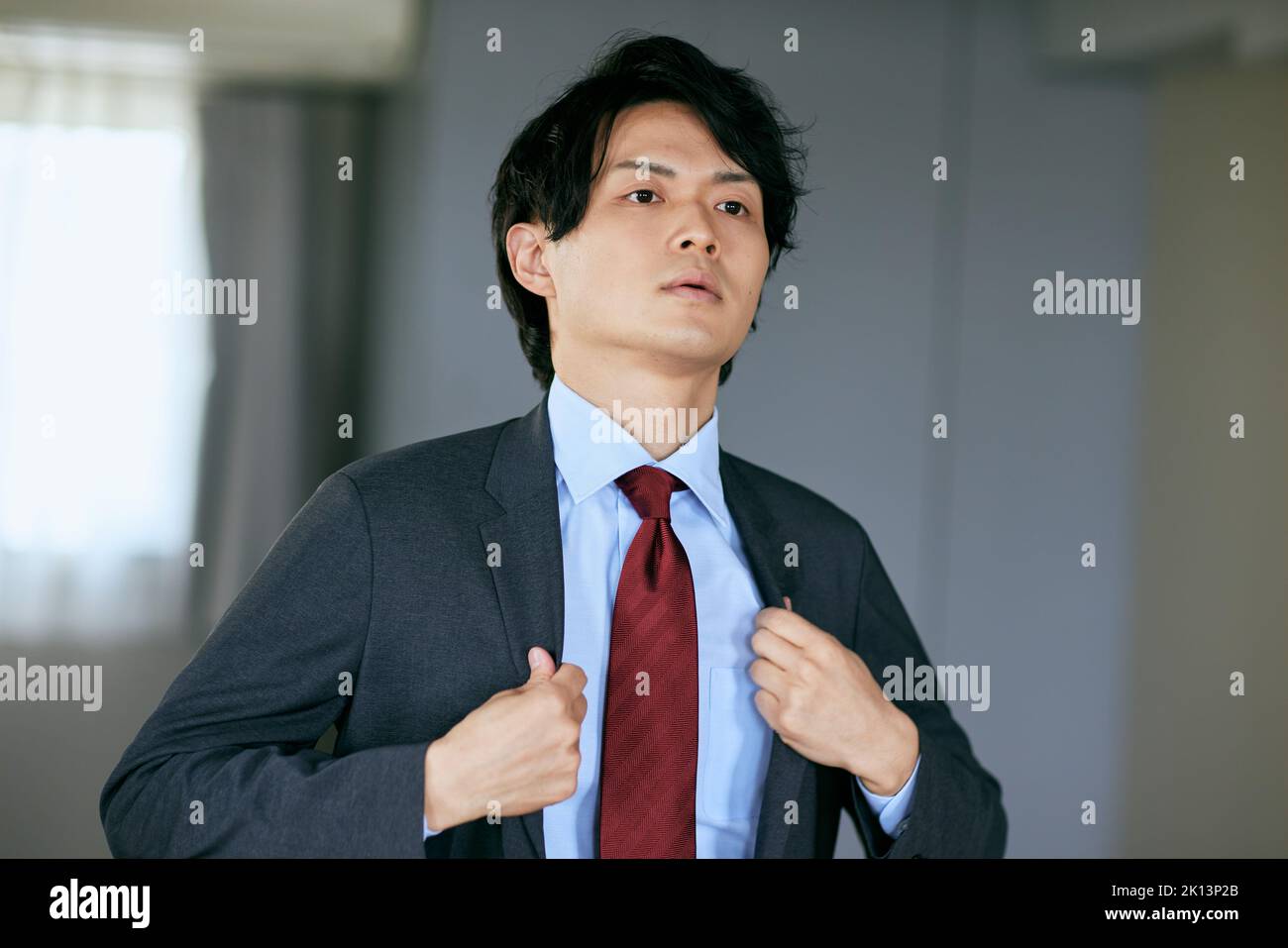 Japanese man getting ready at home Stock Photo - Alamy