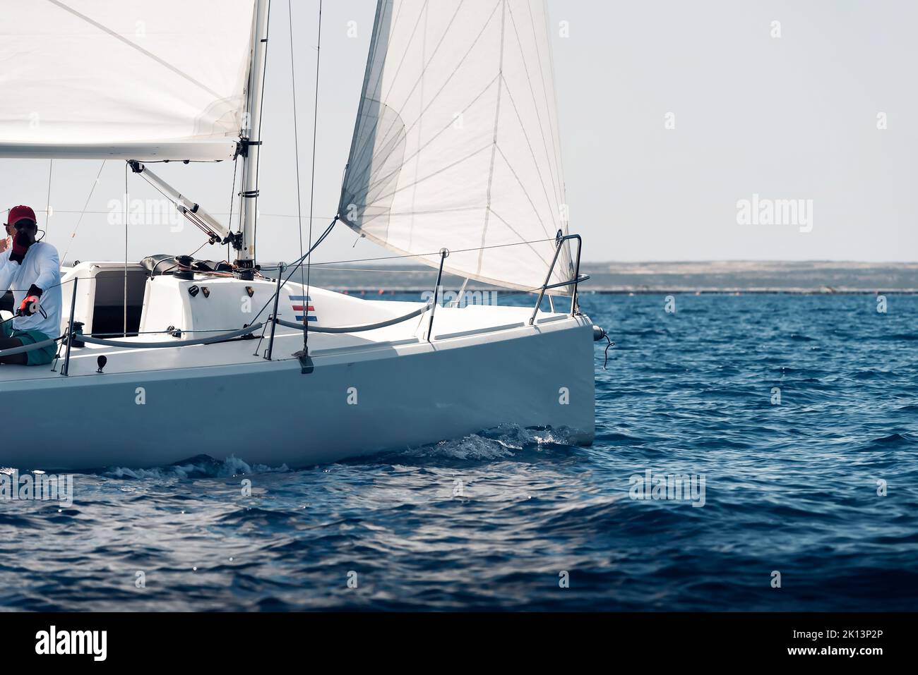 Side view of a sailing yacht during regatta in open sea Stock Photo - Alamy
