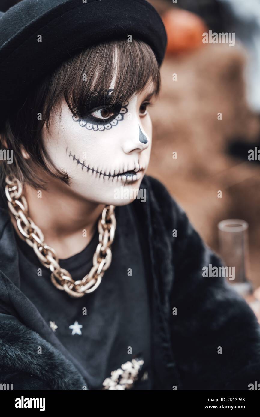 Beautiful scary little girl celebrating halloween. Terrifying black ...