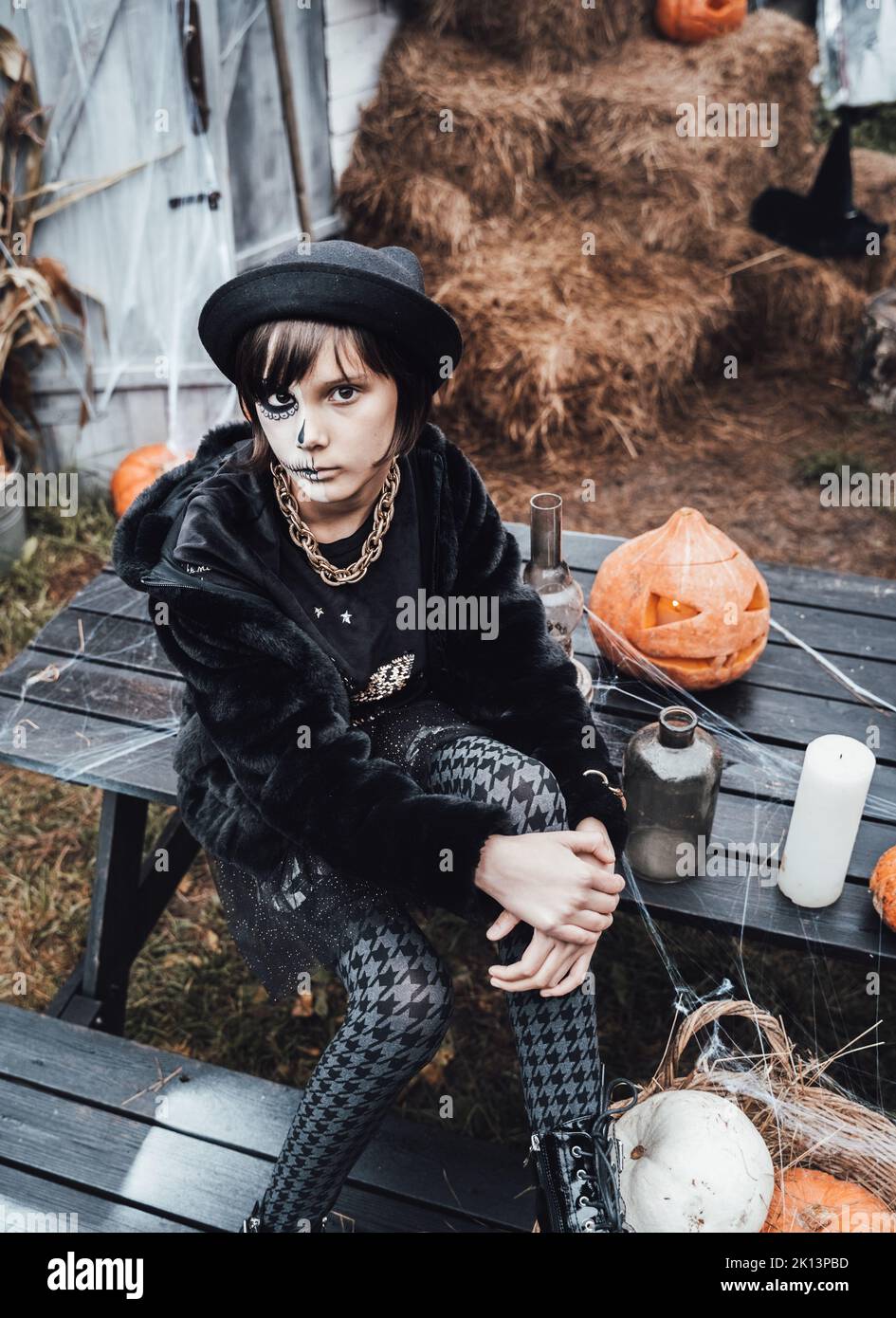 Beautiful scary little girl celebrating halloween. Terrifying black ...