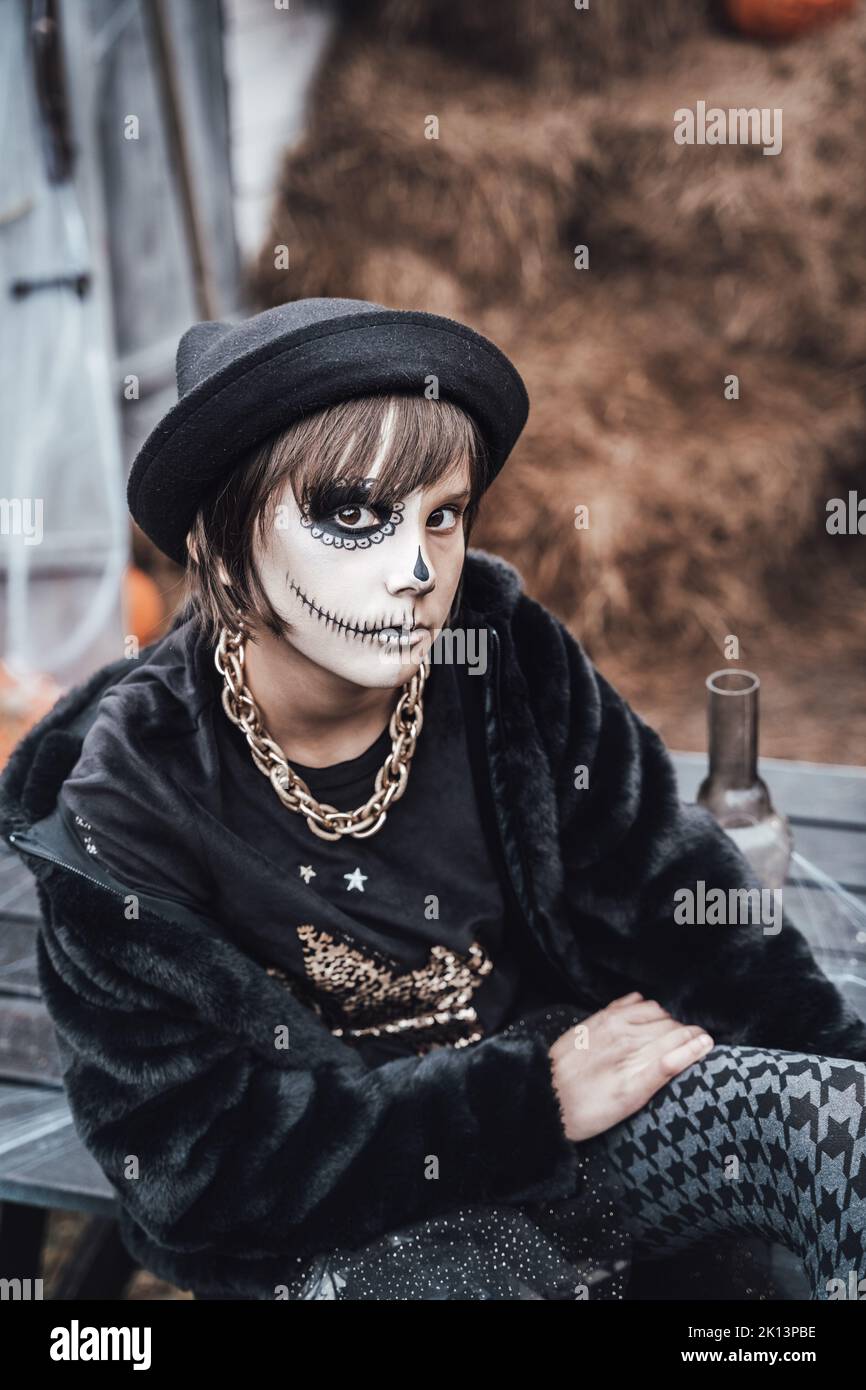 Beautiful scary little girl celebrating halloween. Terrifying black ...