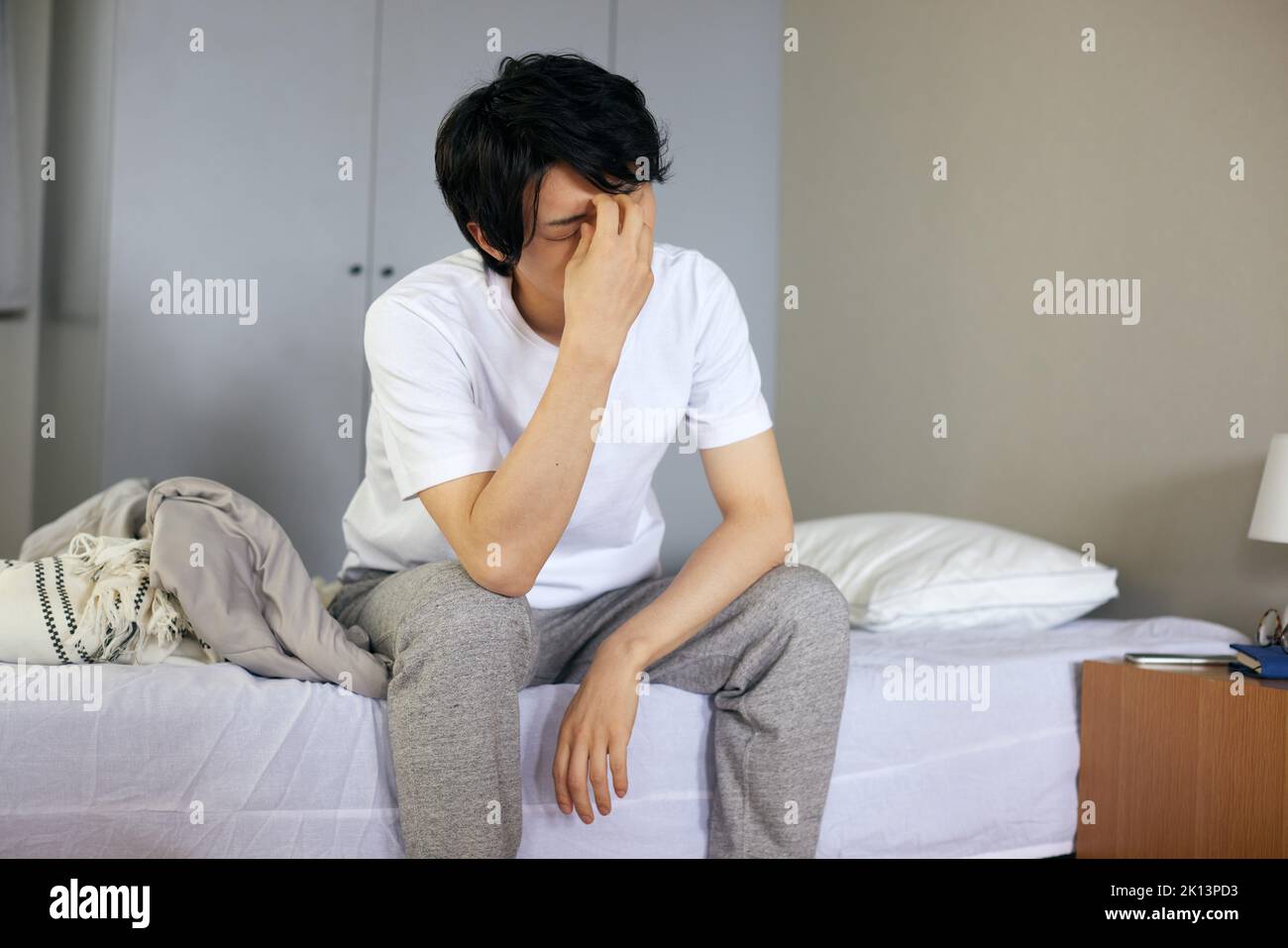 Japanese man waking up Stock Photo - Alamy
