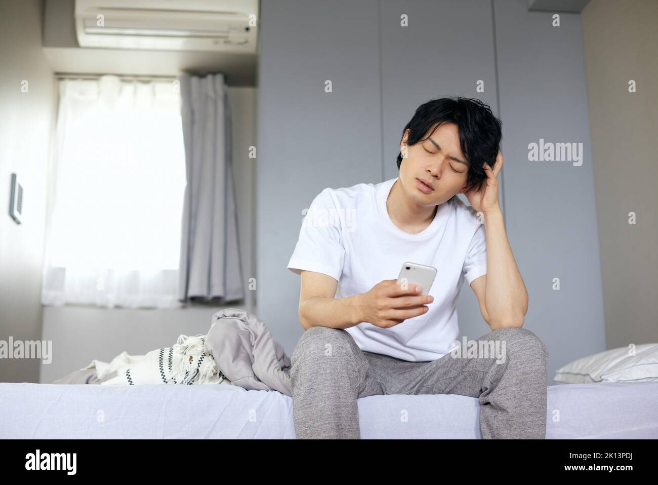 Japanese man waking up Stock Photo - Alamy