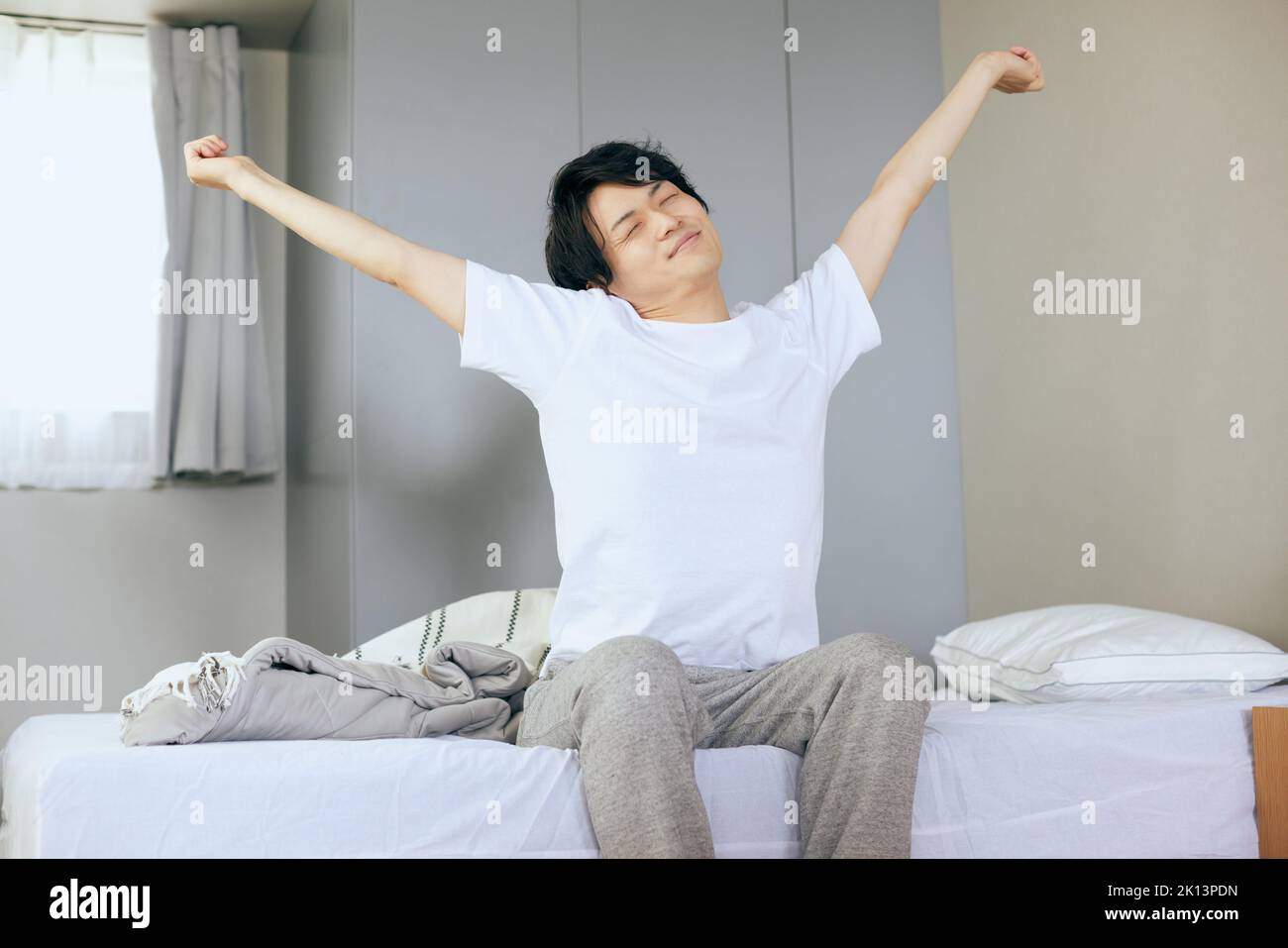 Japanese man waking up Stock Photo - Alamy