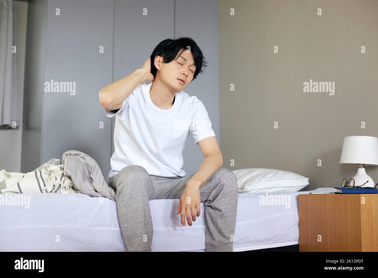 Japanese man waking up Stock Photo - Alamy