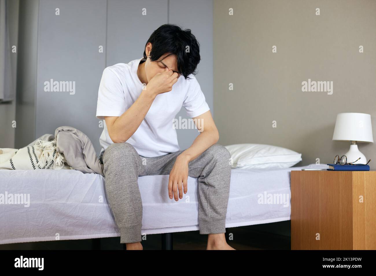 Japanese man waking up Stock Photo - Alamy