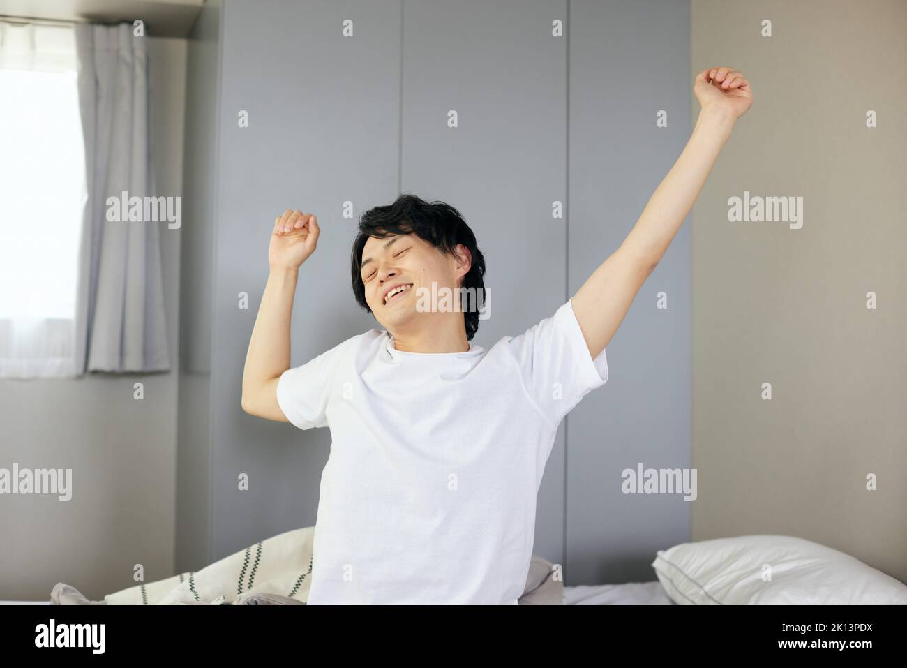 Japanese man waking up Stock Photo - Alamy