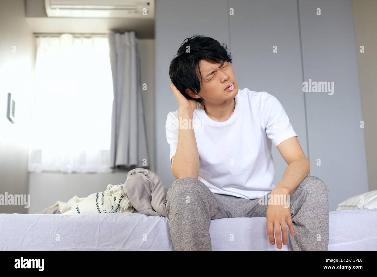 Japanese man waking up Stock Photo - Alamy