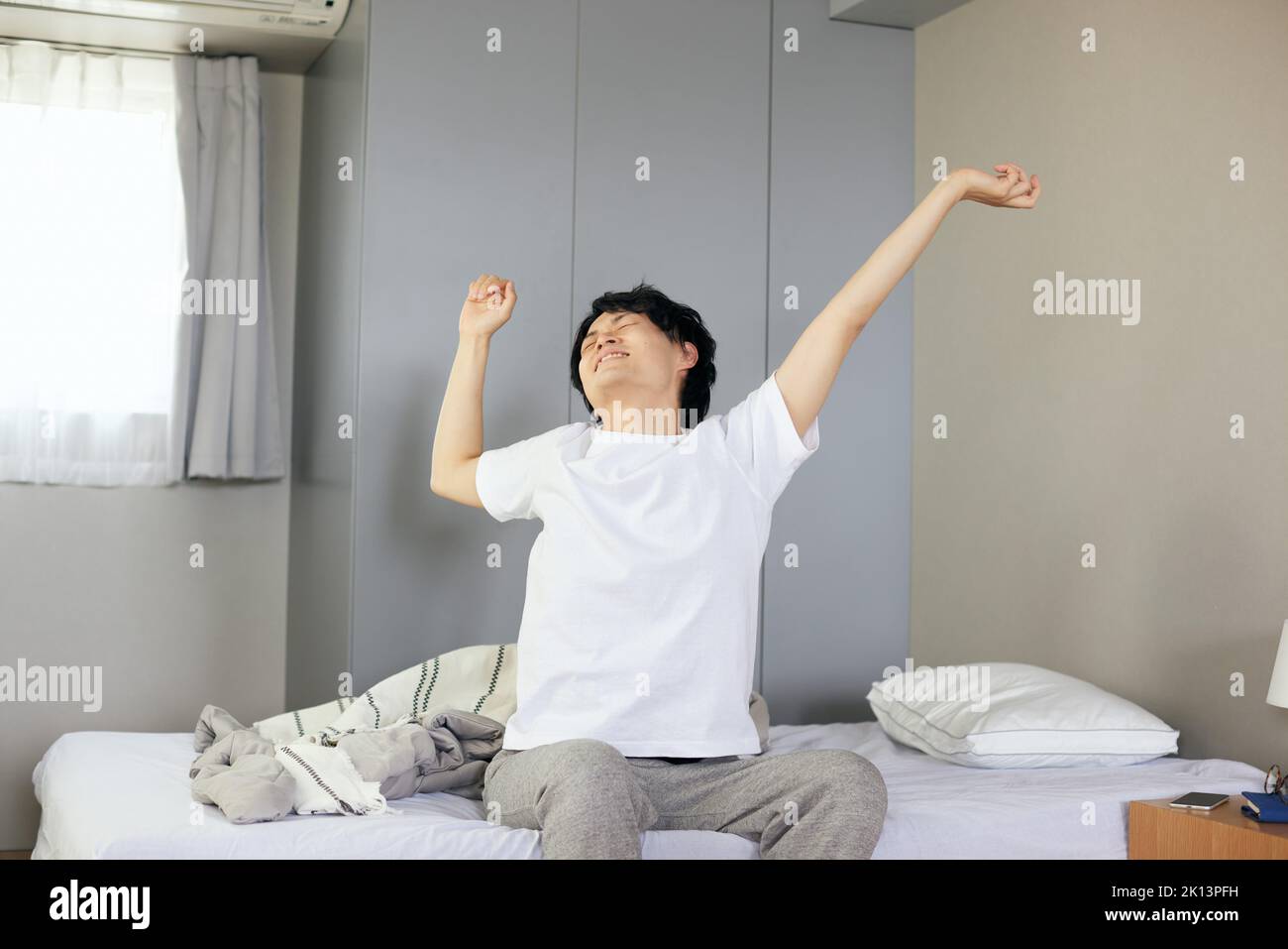 Japanese man waking up Stock Photo - Alamy