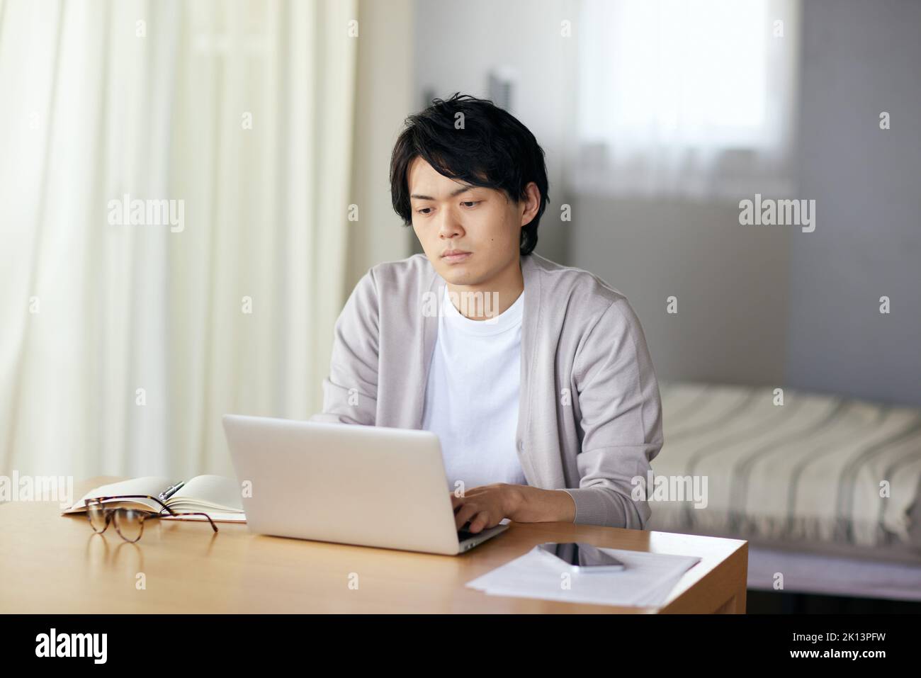 Japanese man working from home Stock Photo - Alamy