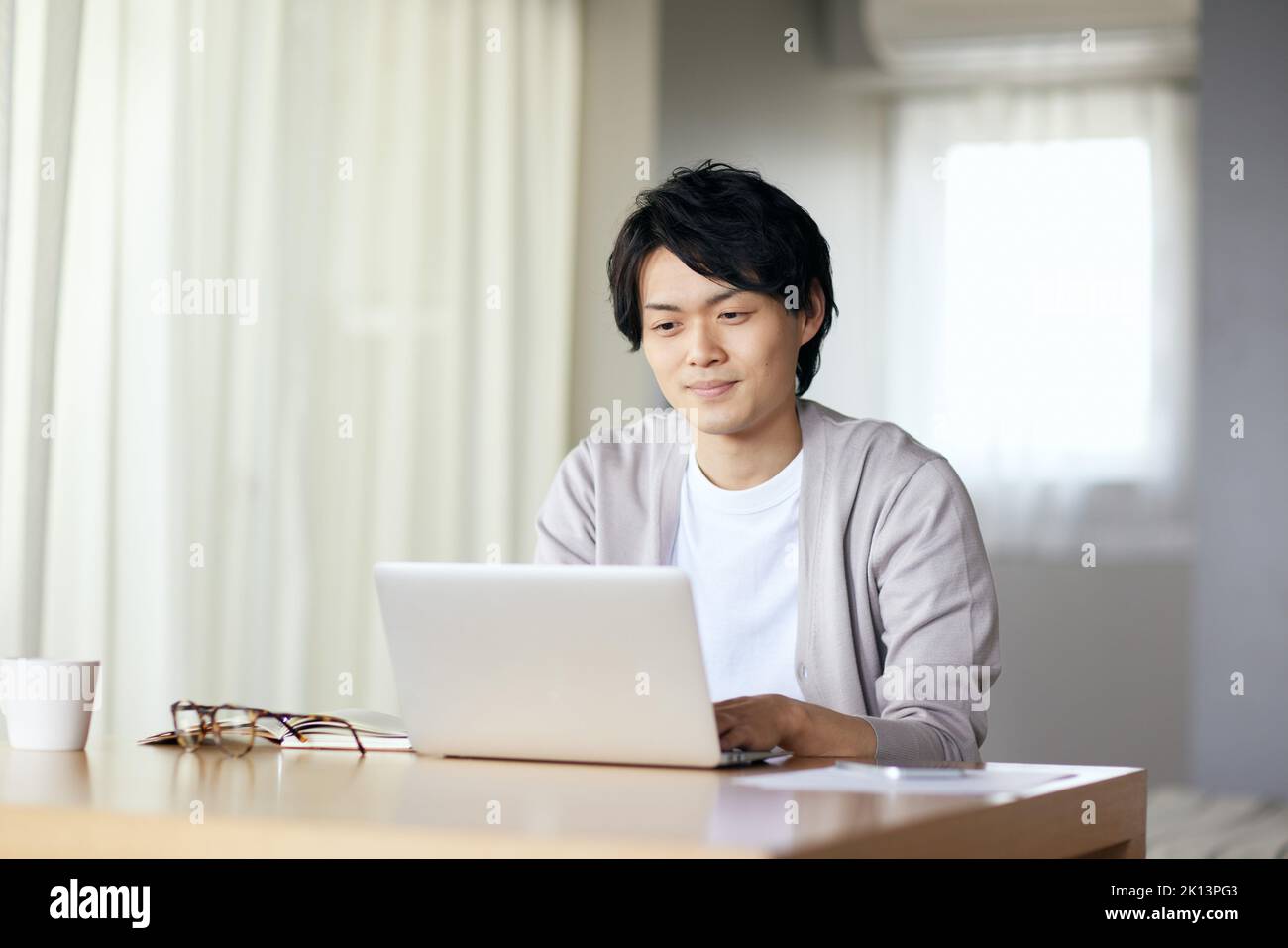 Japanese man working from home Stock Photo - Alamy