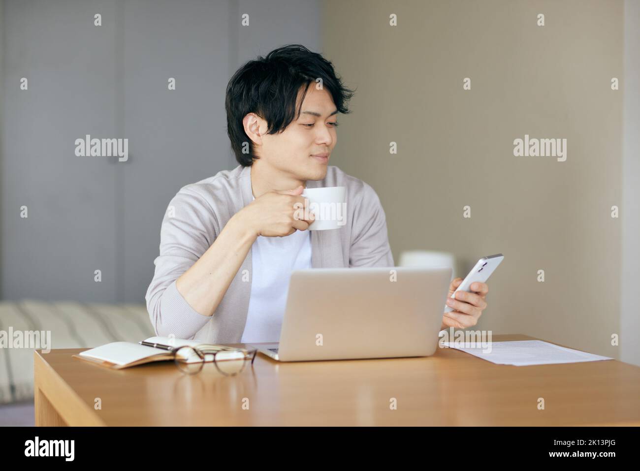 Japanese man working from home Stock Photo - Alamy